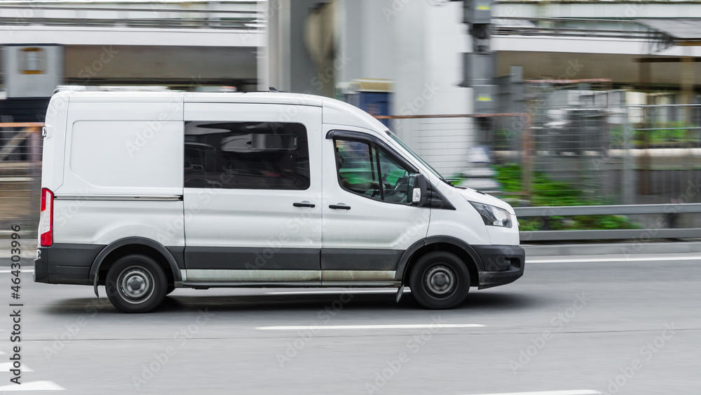 Ford Transit Fourth generation in the city street. Side view of white ...