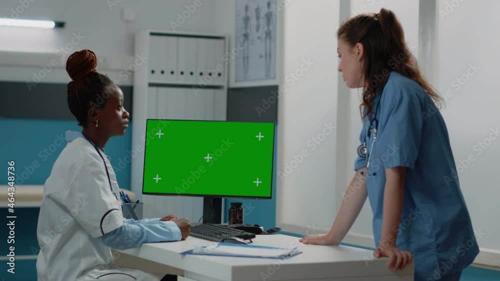 Group of doctor and nurse working with green screen on monitor in ...