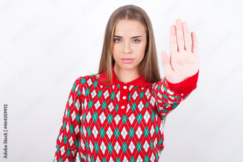 Young beautiful caucasian girl wearing christmas sweaters on white ...