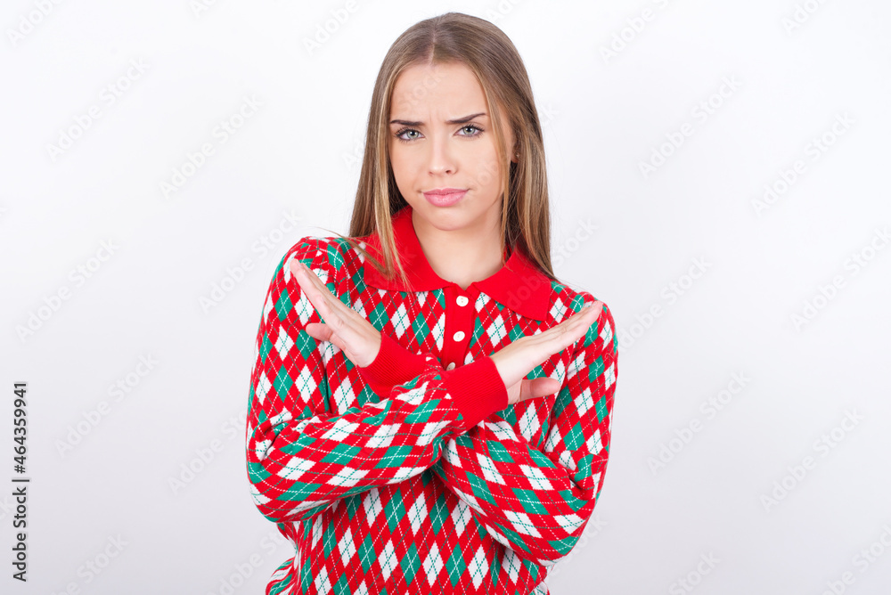 Young beautiful caucasian girl wearing christmas sweaters on white ...