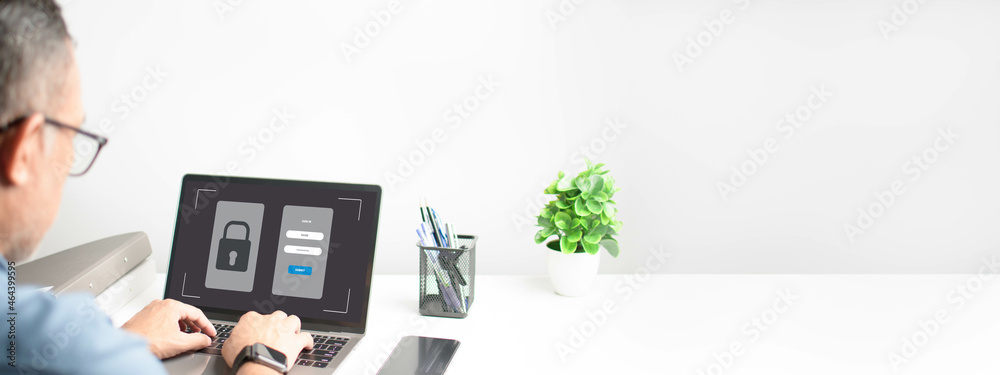 Men typing on a keyboard to use computer network. Laptop screen showing ...