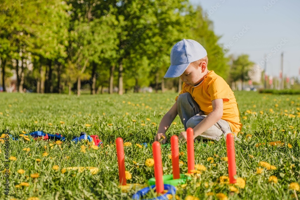 game kid boy fun grass. family toy. Stock Photo | Adobe Stock