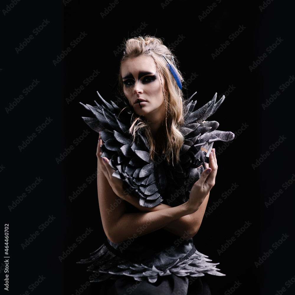 Beautiful woman in makeup and costume for halloween on a black ...