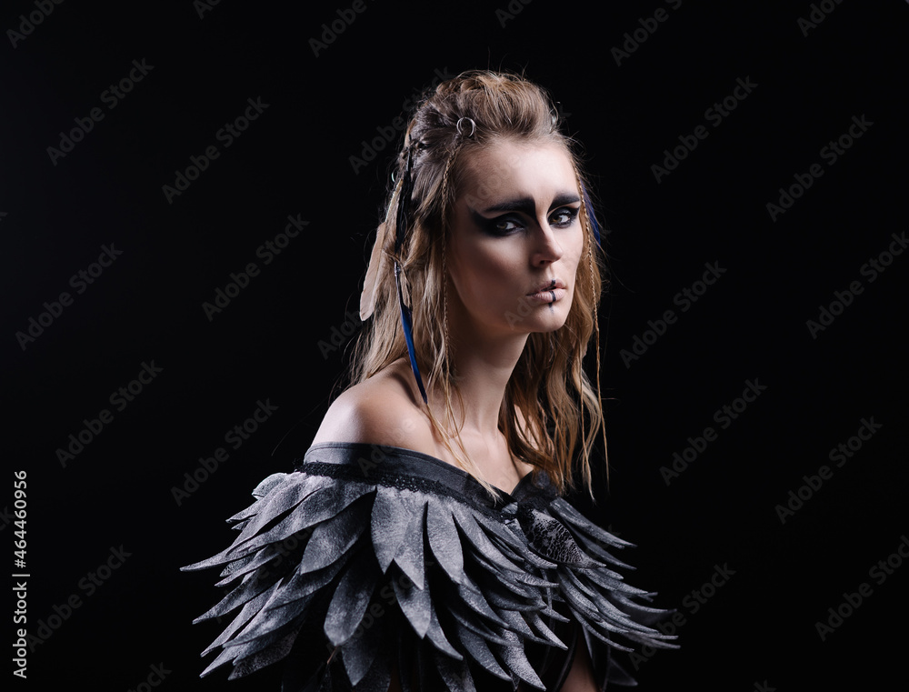 Beautiful woman in makeup and costume for halloween on a black ...