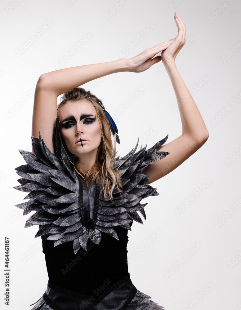 Beautiful woman in makeup and costume for halloween on a white ...