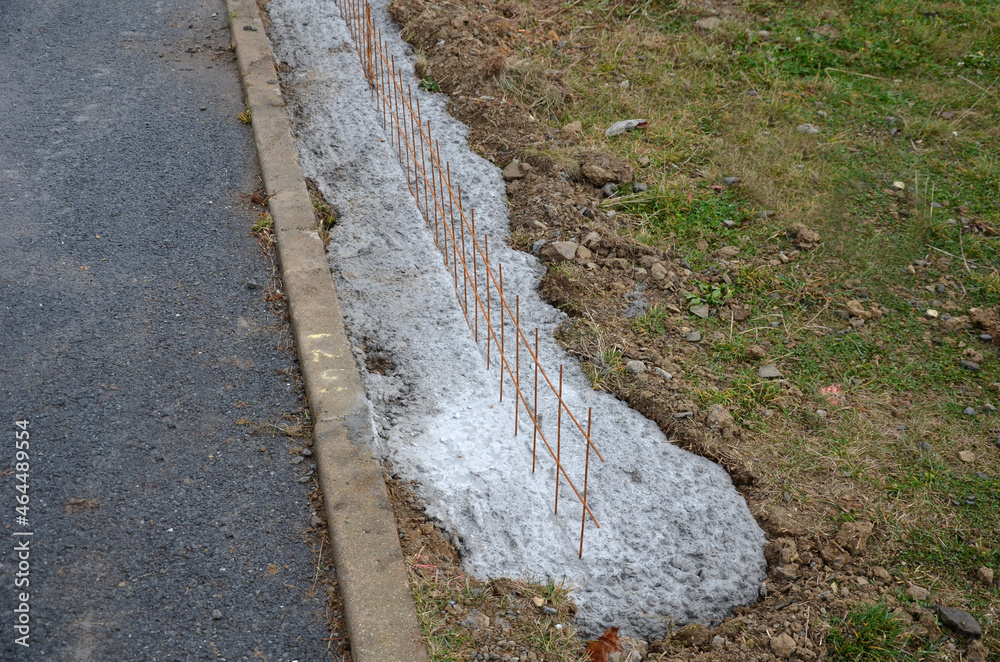 construction of a concrete wall from concrete blocks filled inside with ...