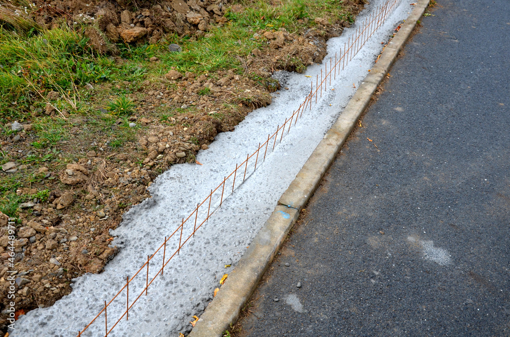 construction of a concrete wall from concrete blocks filled inside with ...