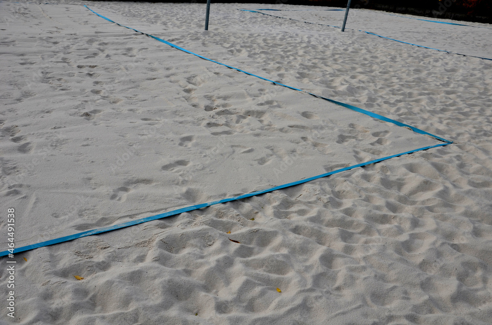 white sand beach volleyball court. white soft dunes fenced with nets ...