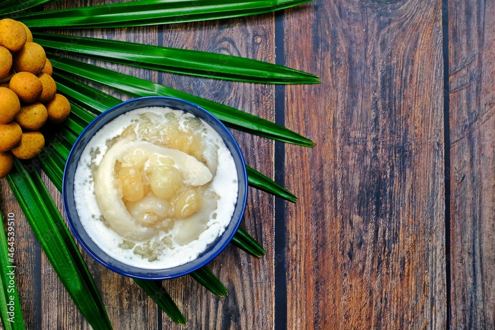 Sweet sticky rice with longan and coconut sliced in coconut milk (Kao ...