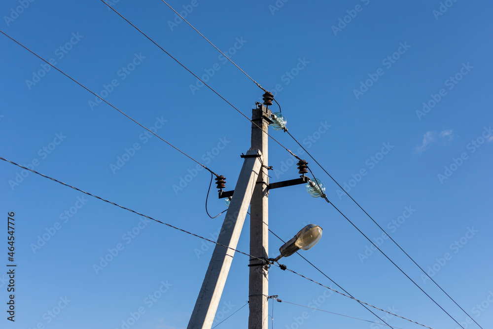 Power pole and power lines in the village Stock Photo | Adobe Stock