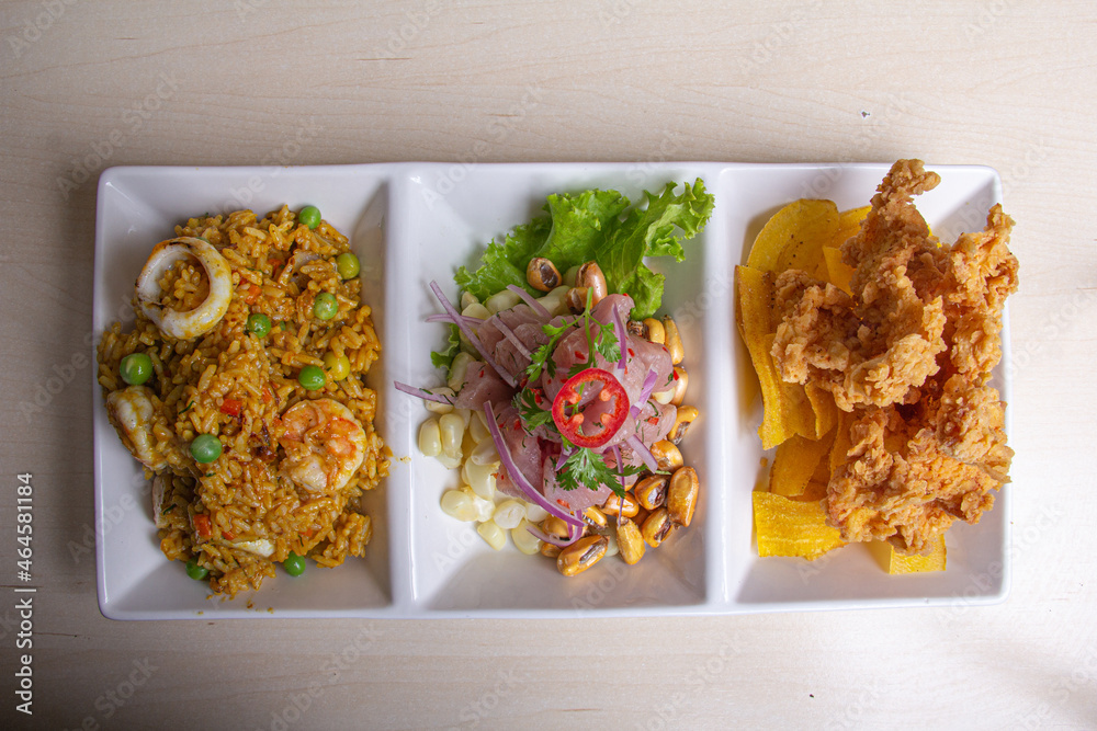 Trios of typical Peruvian dishes, such as ceviche, arroz con pato, papa ...