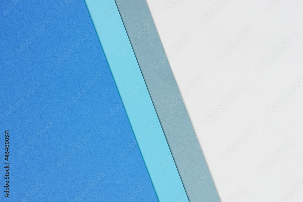 Abstract background on white paper with various shades of blue paper ...
