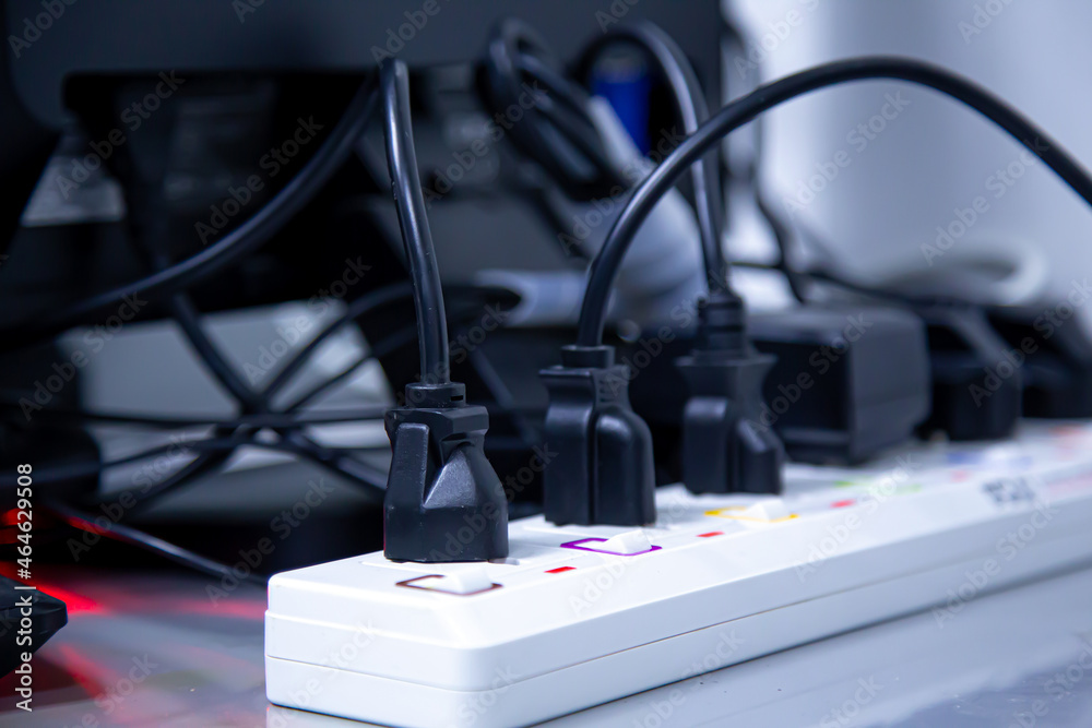 Old and damaged electric adapter power plug has many appliances are ...