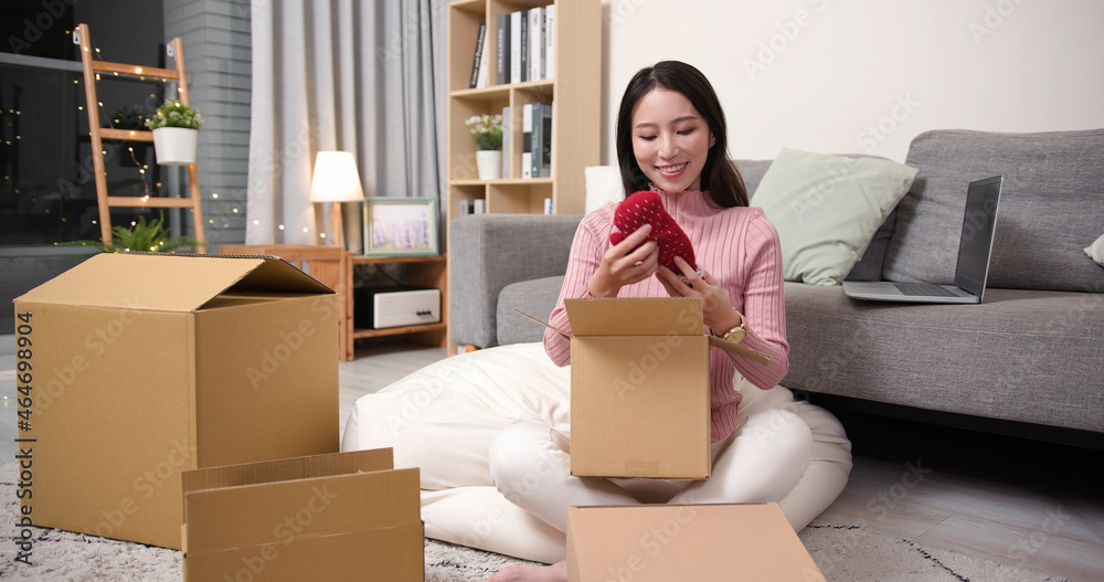 woman open online shopping parcel Stock Photo | Adobe Stock