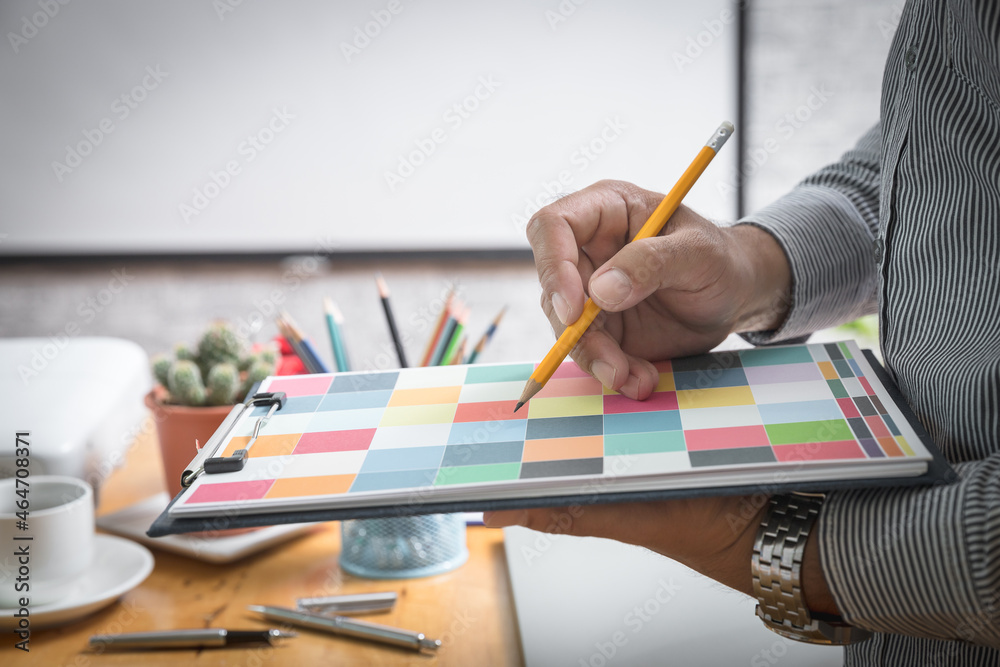 Interior designer chooses a color chart for home design. Graphic ...