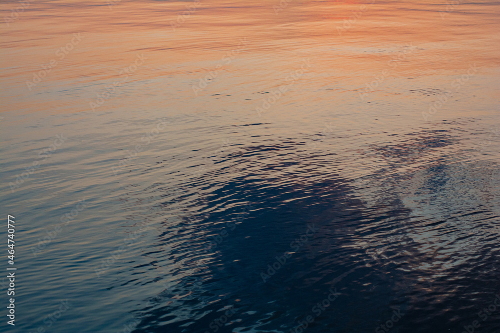 blue and yellow river surface. water surface. water background. blue ...