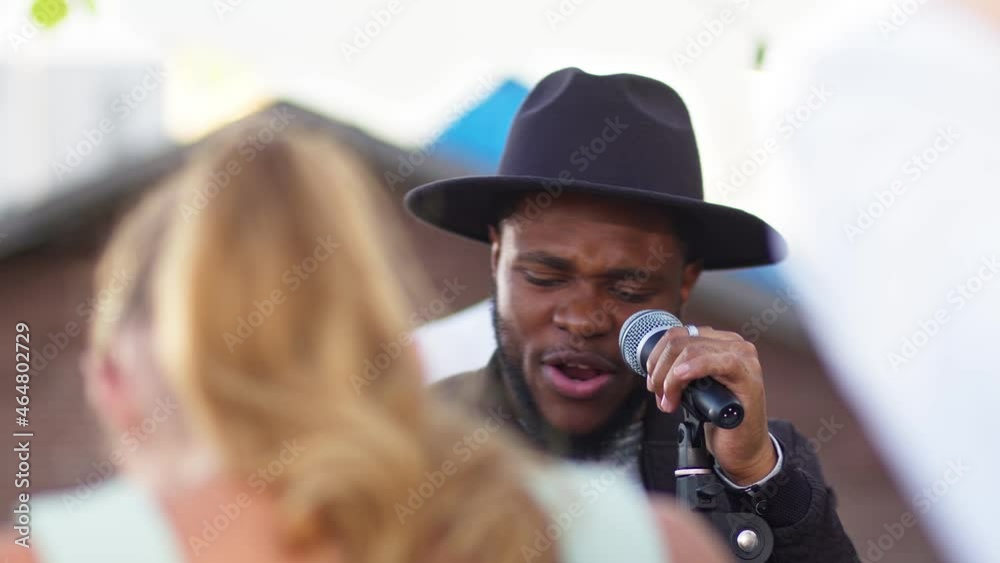Close up of handsome cheerful african american man, singing song on a ...