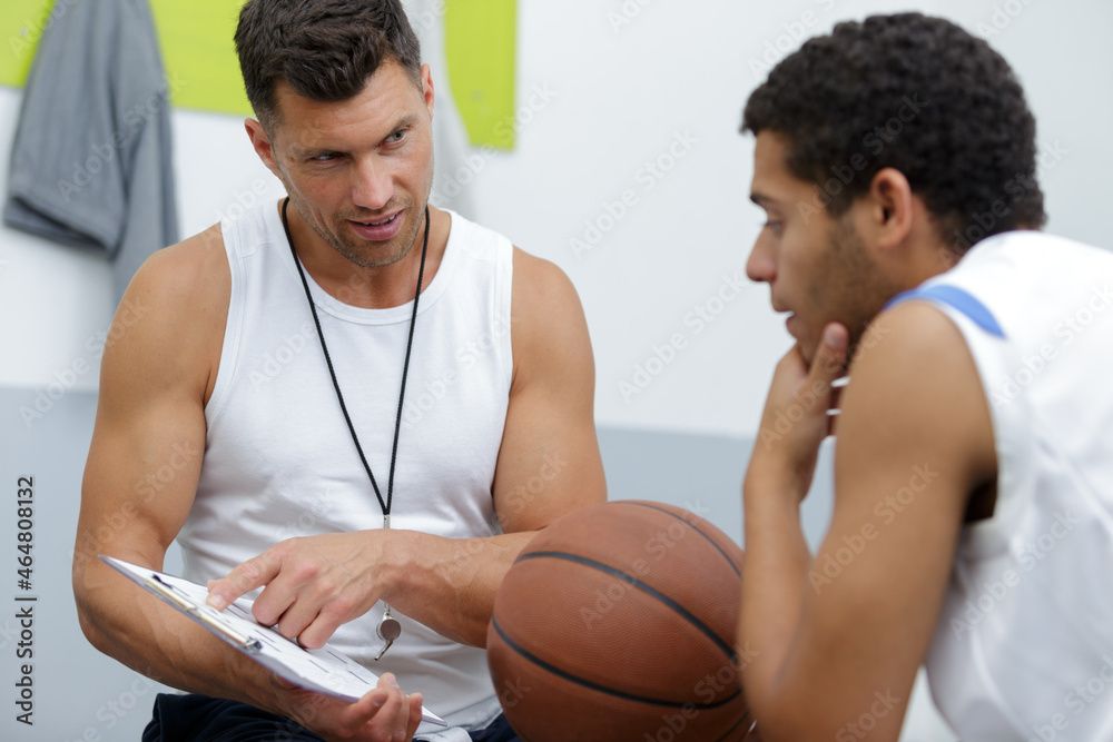 gym teacher with basketball player Stock Photo | Adobe Stock