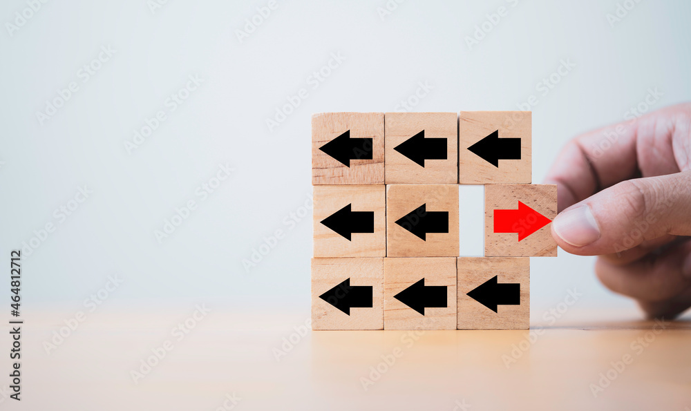 Hand pull out red arrow red arrow which print screen on wooden cube ...