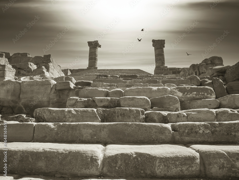 Old steps made from big rocks guarded by two roman architectural ...