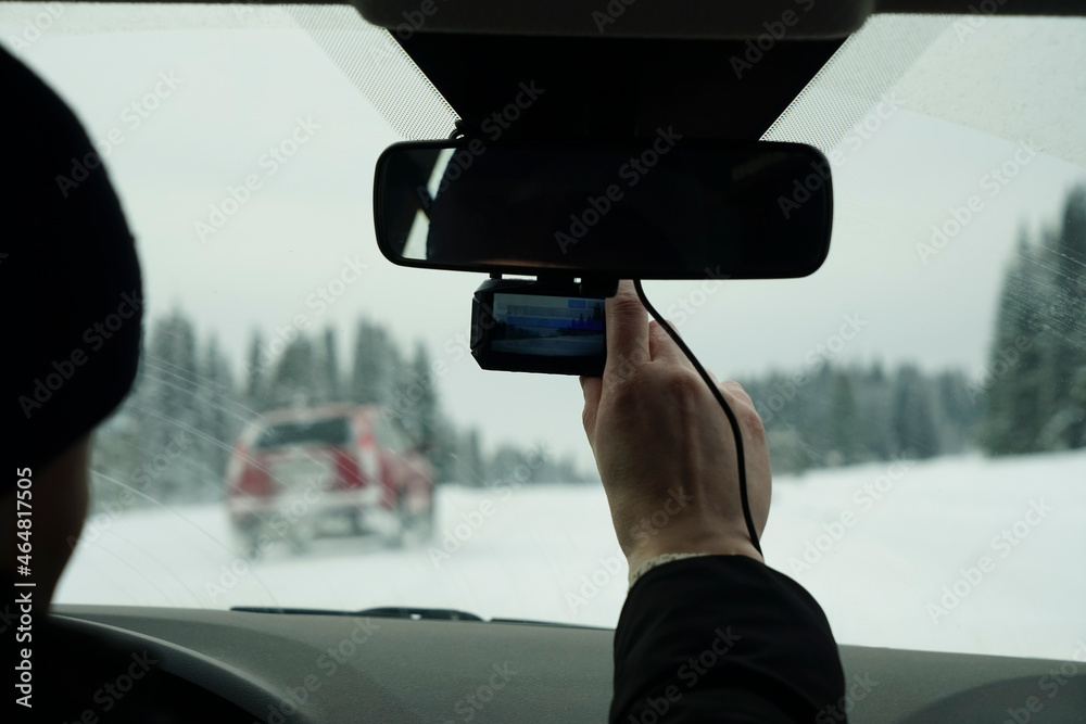 Car video camera (dash cam) installed inside of car with blurred ...