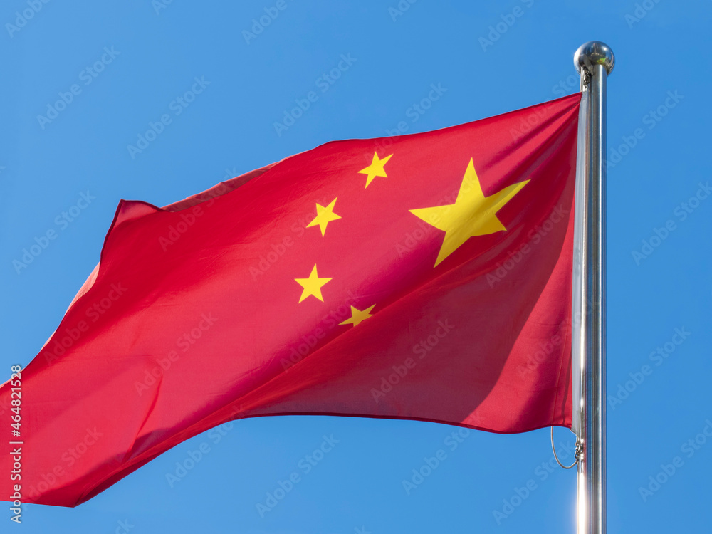 China flag waving against clean blue sky Stock Photo | Adobe Stock