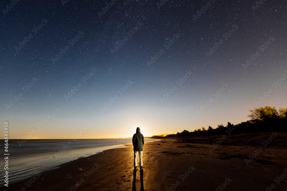 Couple Walking On The Beach At Night