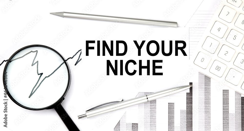 FIND YOUR NICHE text on document with pen,graph and magnifier ...
