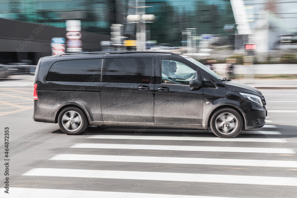 Black passenger van Mercedes-Benz W447 Viano in the city street. Side ...