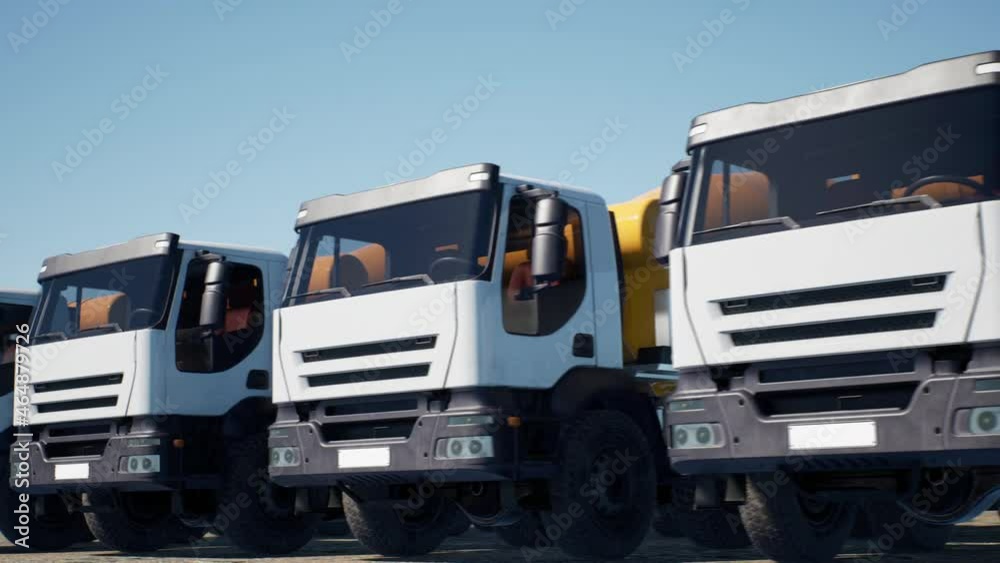 An endless row of cement mixer trucks. Construction machinery fleet ...