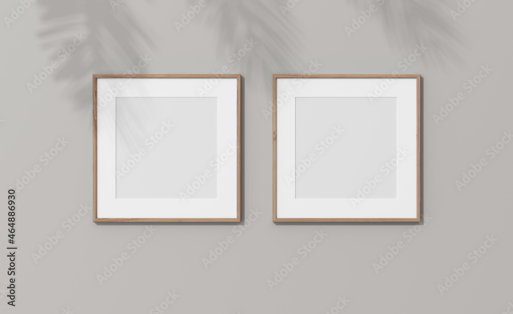 Square wooden frames with passe partout on white wall. 3D render wooden frame mock up in the ...