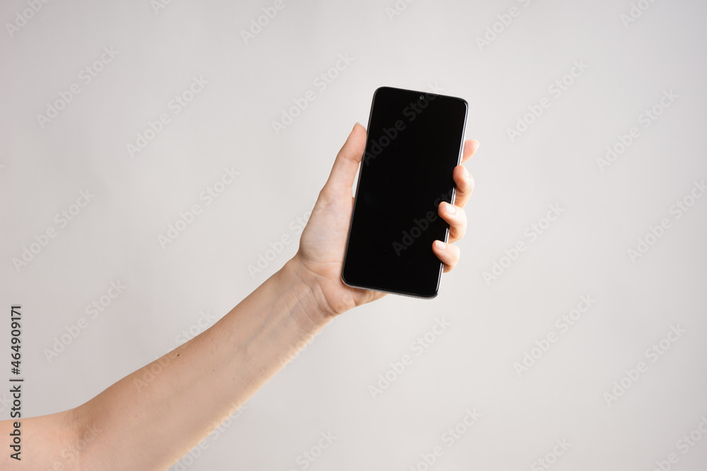 smartphone with a touch screen in a woman's hand. Use your phone with a ...