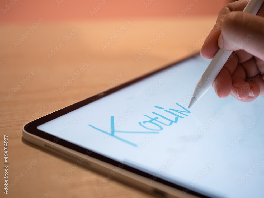 Kotlin Programming languages, concept. The hand makes an inscription ... Kotlin Programming languages, concept. The hand makes an inscription ...