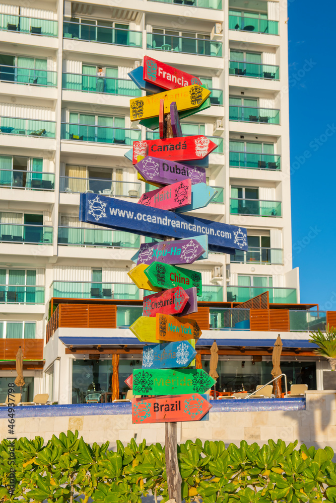 Road sign with country names in different directions on Chacmool Beach ...