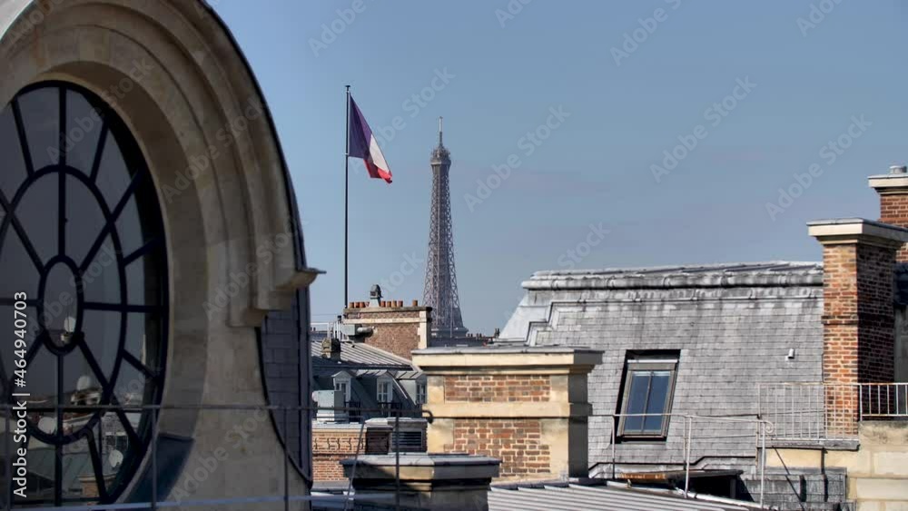 Parisian round window rooftop With Eiffel Tower and tricolore French ...
