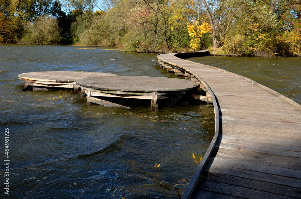 floating walkway made of wooden planks. narrow curved paths on stilts ...