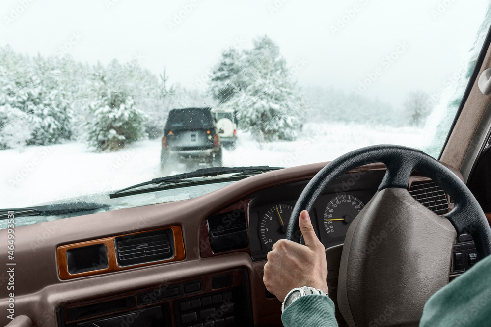 Extreme winter driving on snow off-road car travel. Hand of male driver ...