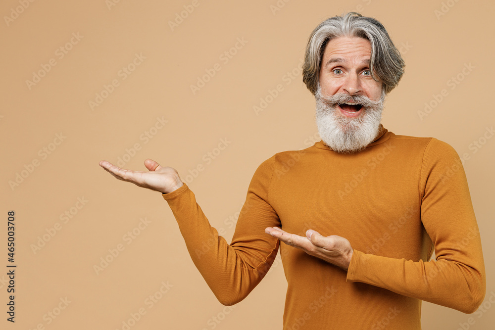 Elderly surprised gray-haired mustache bearded man 50s in mustard ...