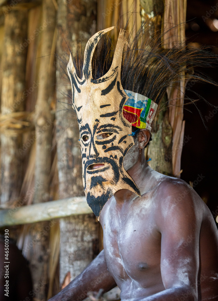 Warrior of the Asmat tribe in a battle mask. Stock Photo | Adobe Stock