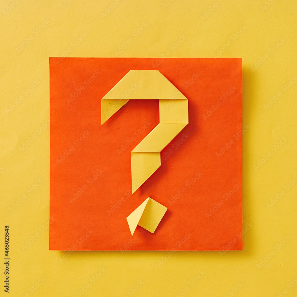 Layered orange and yellow background with origami question mark ภาพถ่าย ...