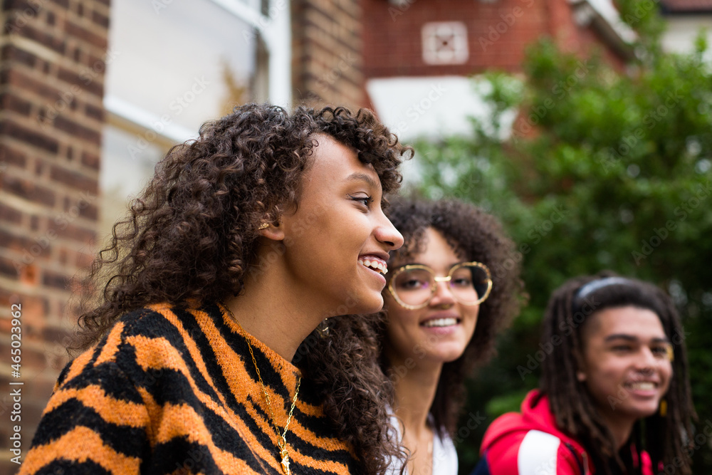 Group of gen z friends hanging out outdoors Stock Photo | Adobe Stock