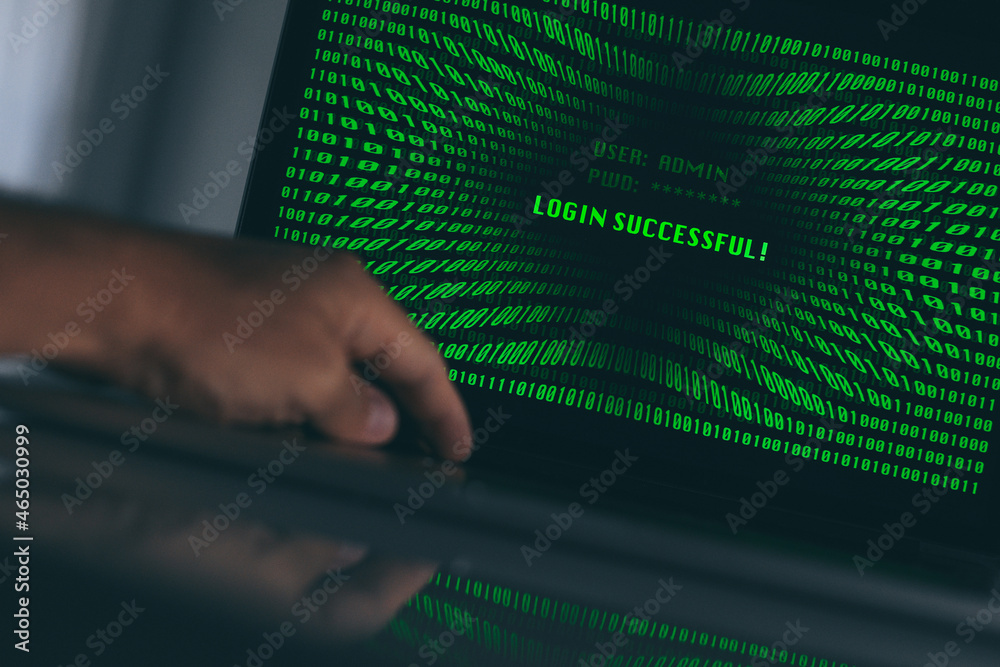 Hand typing on a laptop keyboard green numbers on display. Successful ...