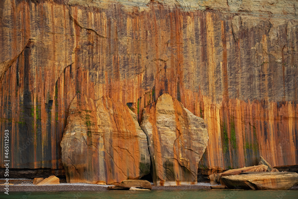 Abstract landscape of mineral stained cliff along the eroded sandstone ...
