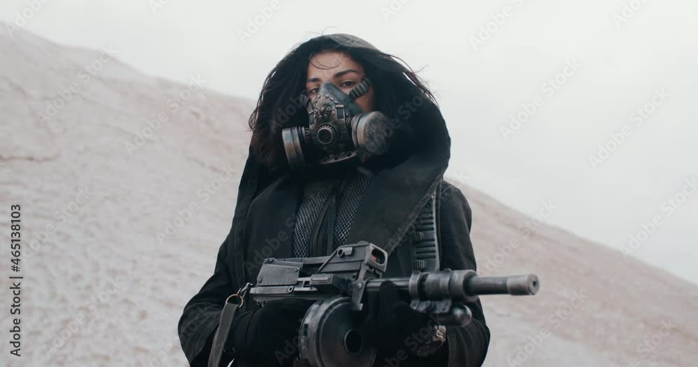Post apocalyptic human, woman in grunge clothes hooded black mantle ...