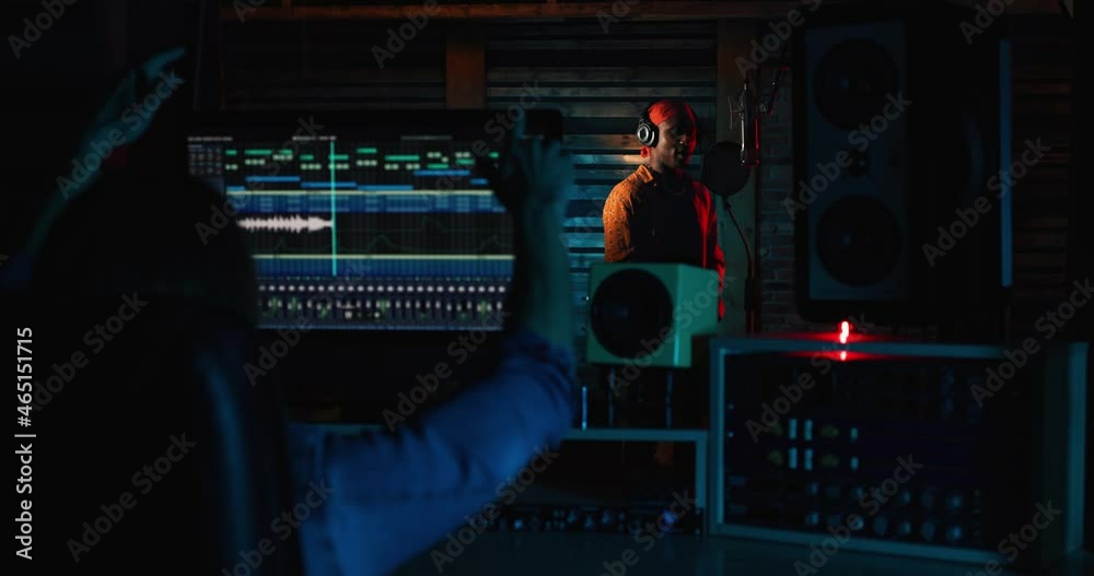 Male producer in Music record Studio looking at Afro-American rap ...
