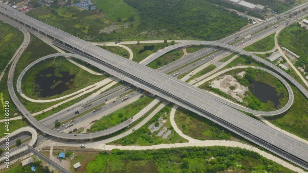 Aerial view of highway junctions with roundabout. Bridge roads shape ...