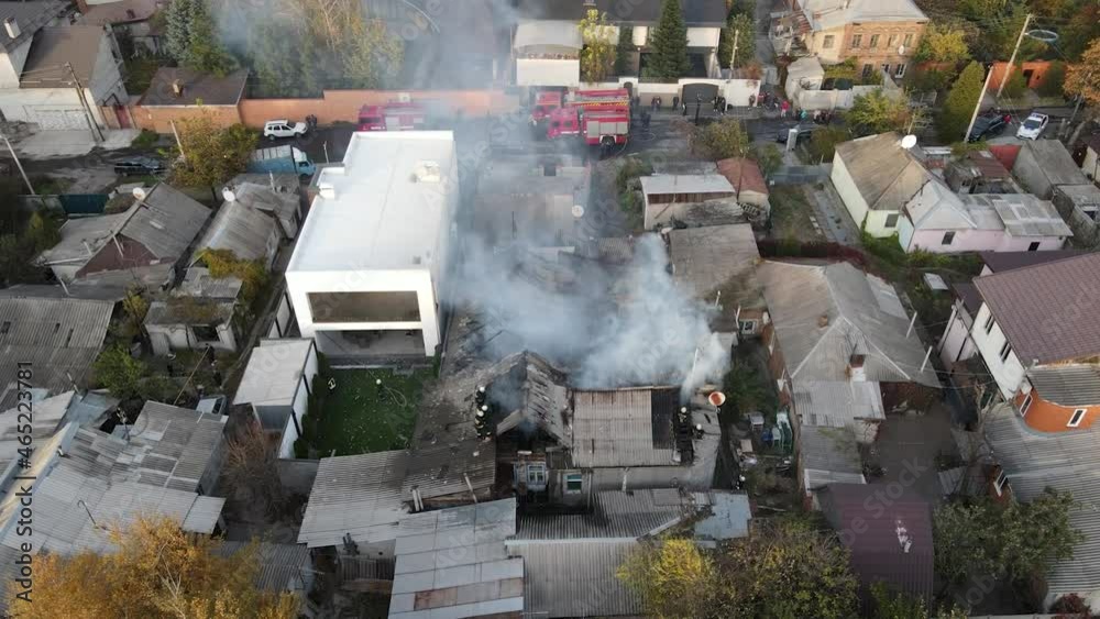 Fire in a private house. Strong smoke from fire from a bird's eye view ...