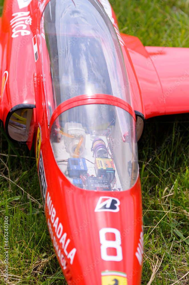 Radio controlled plane placed on a ground grass, electronics equipment ...