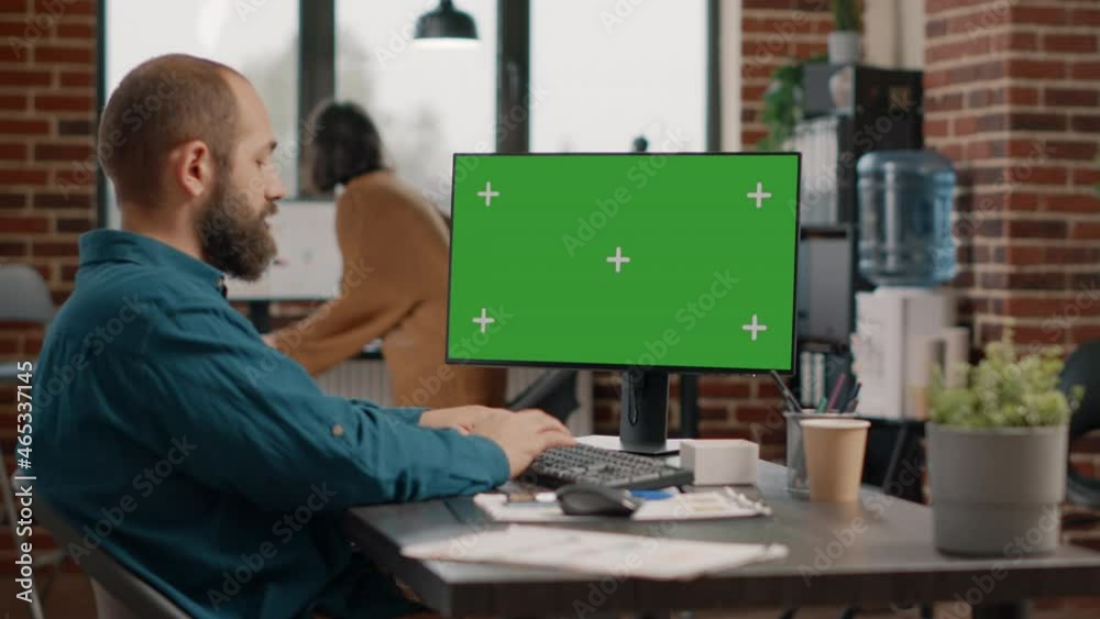 Entrepreneur working with green screen on computer to plan business ...