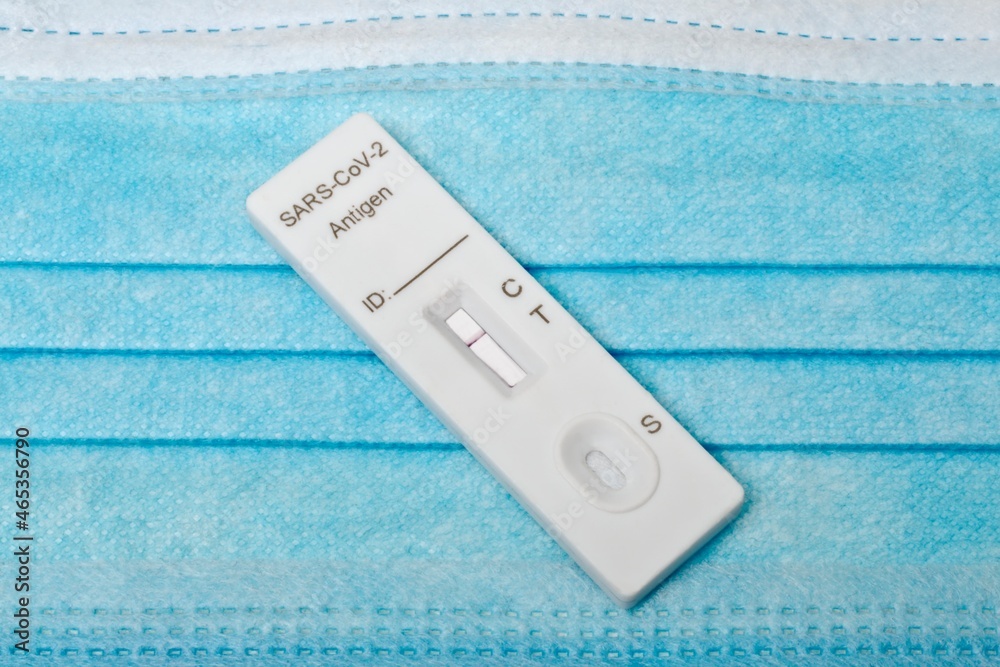 Covid-19 antigen self test lies on a anti virus protection mask. Stock ...